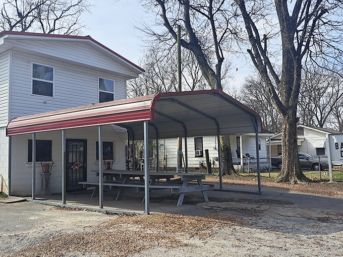 The pilgrimage begins here. This unassuming white building with its metal carport awning houses barbecue treasures that have earned national recognition and devoted followers.