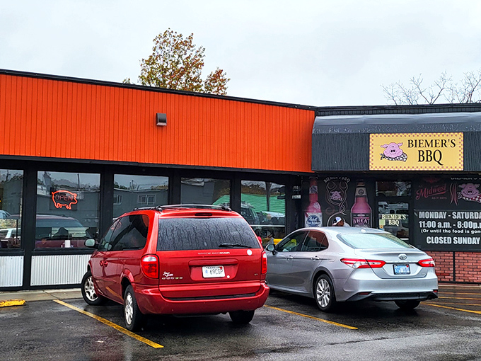 The bright orange exterior of Biemer's BBQ stands like a beacon of hope for hungry travelers. This unassuming building houses smoky treasures that draw pilgrims from across Kansas.