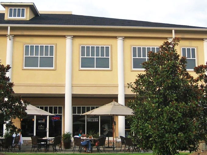 The unassuming facade of Nantucket Grill promises Maine lobster tails and coastal delights, proving great food often hides behind modest exteriors.