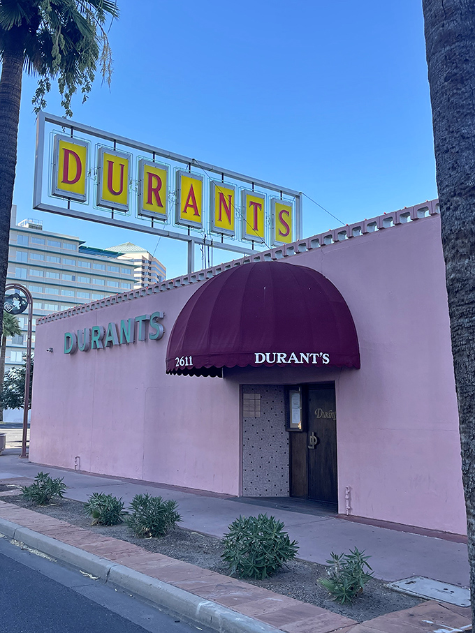 The iconic pink exterior of Durant's stands proudly on Central Avenue, a mid-century mirage in downtown Phoenix's urban landscape.