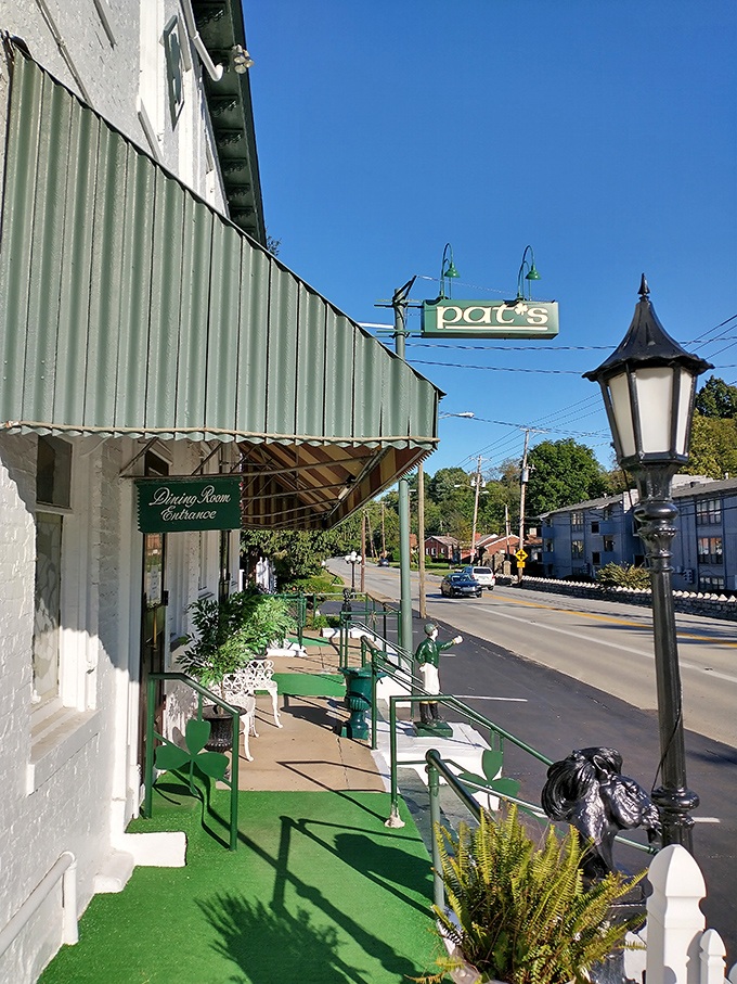 The unassuming green exterior of Pat's Steakhouse hides culinary greatness like a superhero's secret identity. That modest sign has guided hungry Louisvillians for generations.