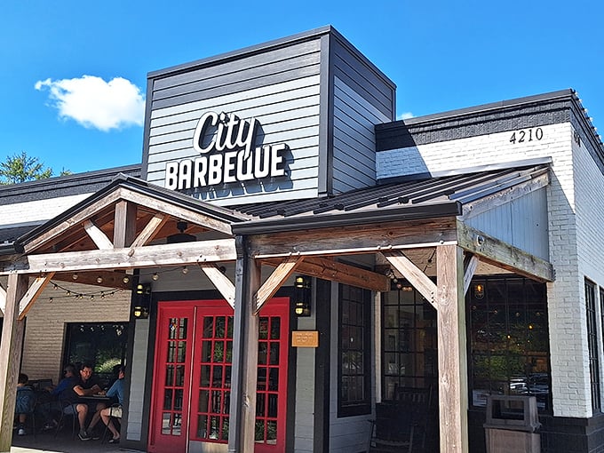 The rustic wooden beams and bright red doors of City Barbeque aren't just inviting&mdash;they're practically a smoke signal to your stomach saying "come hither."