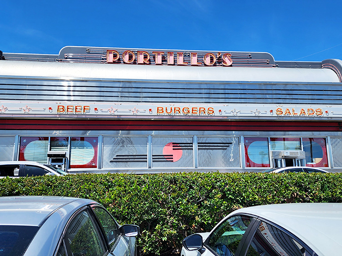 The neon-drenched exterior of Portillo's glows like a beacon of Midwestern comfort food in the Southern California night. Chicago never looked so good in California.