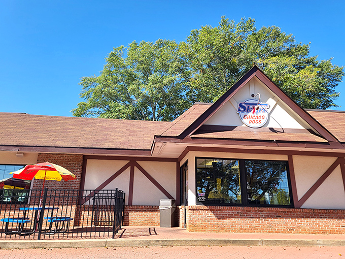 The Tudor-style exterior of Skip's Chicago Dogs stands as a welcoming beacon of Midwest flavor in the heart of Avondale Estates.