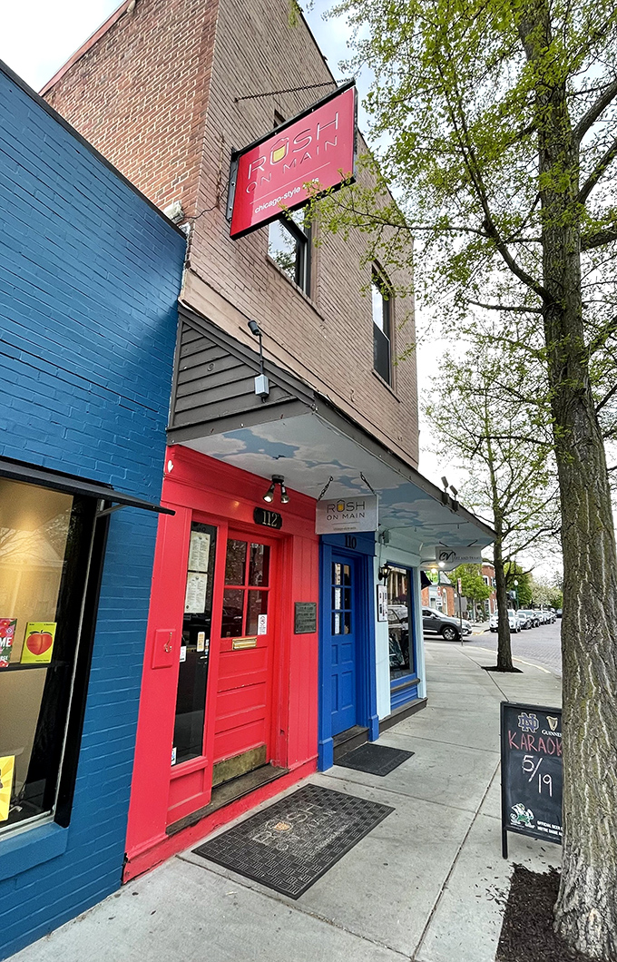The bright red door at Rush on Main stands out like a beacon on Zionsville's Main Street, promising Chicago-style delights within these historic walls.