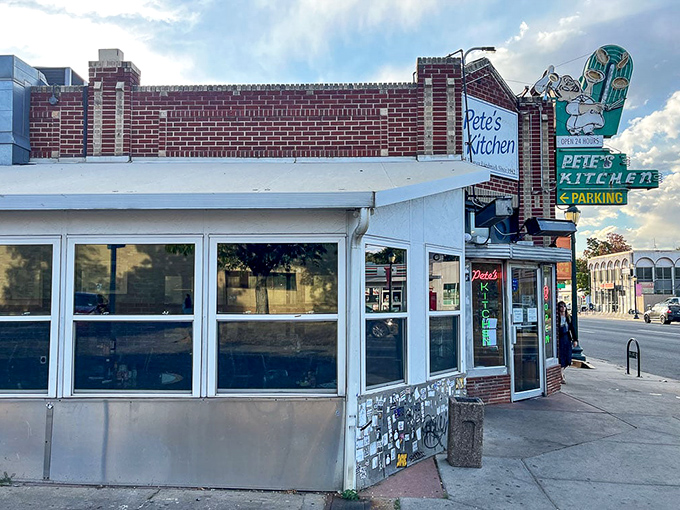 That iconic neon sign beckons like an old friend, promising comfort food and conversations that matter on Denver's storied Colfax Avenue.