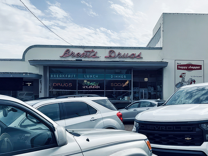 The iconic Brent's Drugs sign glows like a beacon of nostalgia, promising comfort food and conversations that matter in Jackson's Fondren District. 
