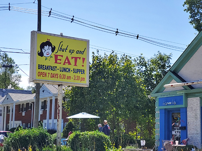 The mint-green exterior of Shut Up and Eat beckons hungry travelers with colorful outdoor seating and a sign that gets straight to the point.