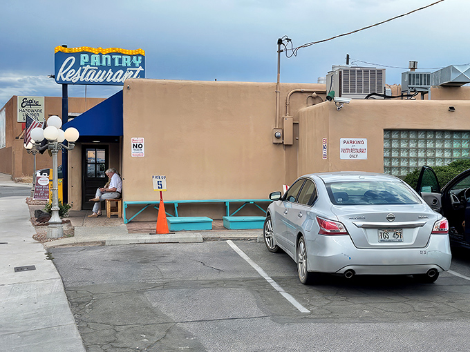 That iconic blue awning against adobe walls isn't just a sign&mdash;it's a beacon of breakfast hope for hungry Santa Feans who know the early bird gets the huevos.