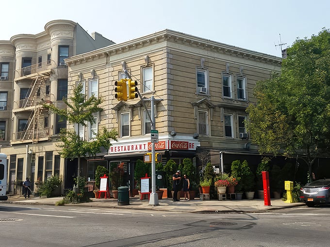 That iconic Coca-Cola sign and vintage storefront—Tom's Restaurant stands like a time capsule of old Brooklyn, promising breakfast bliss behind those doors.