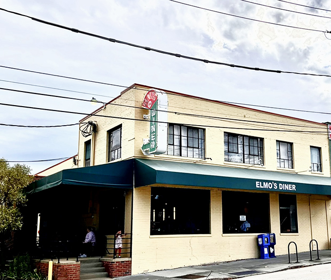 The unassuming yellow exterior of Elmo's Diner stands like a beacon of breakfast hope on Durham's Ninth Street, promising comfort within its walls.