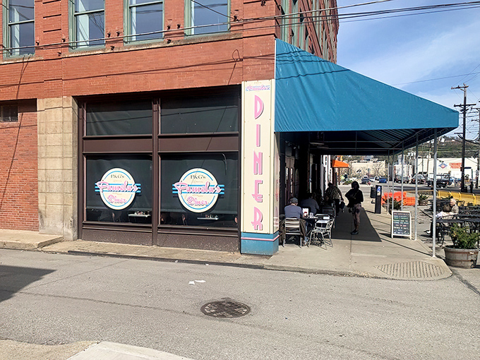 The iconic teal awning of Pamela's Diner beckons hungry Pittsburghers like a breakfast lighthouse guiding ships to delicious shores. 