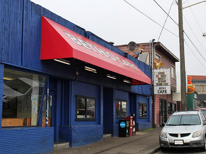 The iconic blue exterior with its bright red awning has been beckoning hungry Seattleites for generations, like a breakfast lighthouse in a sea of ordinary restaurants. 
