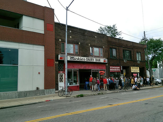 The iconic Mickies Dairy Bar sign stands proudly against Madison's skyline, a beacon of breakfast hope for hungry Badger fans and locals alike.