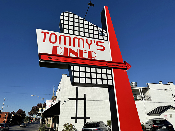 Tommy's Diner stands like a time capsule on West Broad Street, its classic black awning and white brick promising honest-to-goodness comfort inside.