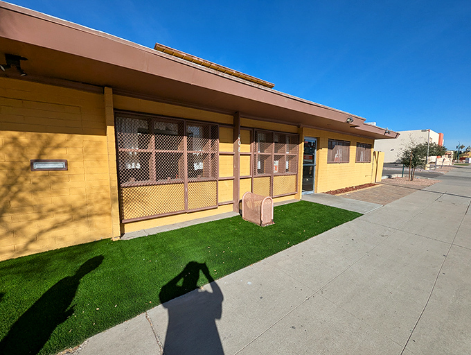 The unassuming yellow exterior of Mrs. White's Golden Rule Cafe stands like a beacon of culinary promise, boldly advertising its famous chicken fried steak.