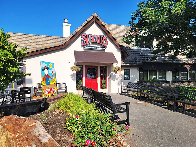 The iconic red doors of Stroud's welcome you like an old friend's embrace &ndash; promising comfort and legendary fried chicken inside.
