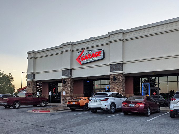 The neon-lit beacon of Smitty's Garage stands proud against the Arkansas sky, promising burger salvation to all who enter.