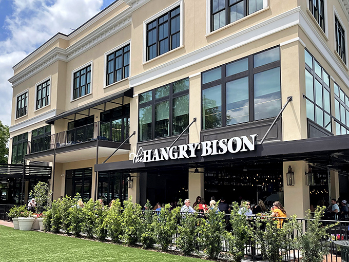The distinctive red facade of The Hangry Bison stands out in Winter Park like a beacon for burger enthusiasts seeking meaty salvation.