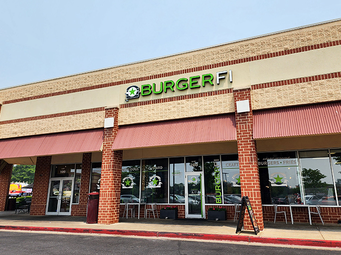 BurgerFi's Columbia storefront stands ready to welcome hungry Marylanders with its distinctive green signage and brick facade—burger paradise awaits behind those doors.