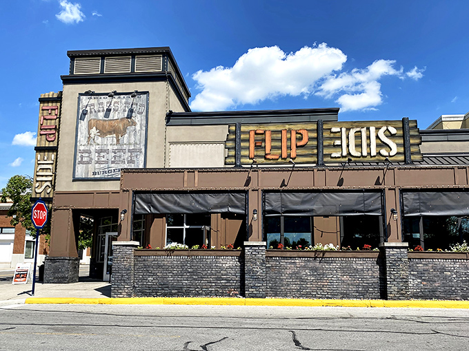 The wooden "FLIP SIDE" sign beckons like a lighthouse for the burger-obsessed. Those flower boxes aren't just pretty&mdash;they're a promise of good things to come.