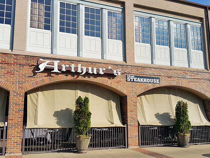 The modern fa&ccedil;ade of Arthur's Prime Steakhouse belies the old-world charm within. String lights create an inviting glow as evening approaches.
