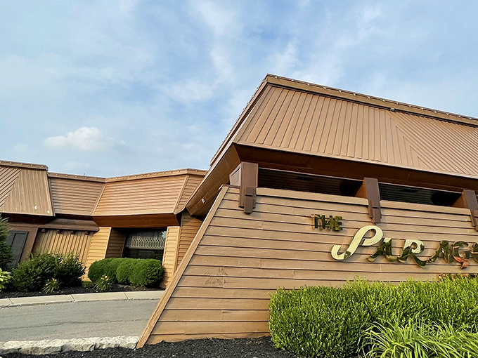 The unassuming exterior of The Paragon stands like a time capsule from the 1970s, promising retro delights within its wood-paneled walls.