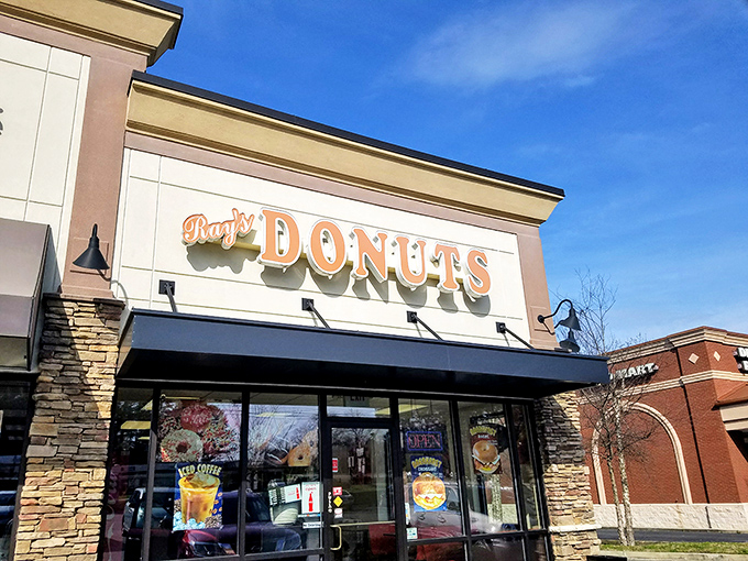 The siren call of that "Donuts" sign hits different at 7am &ndash; Ray's storefront promises morning salvation in strip mall form.