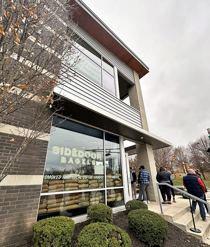 The unassuming exterior of Sidedoor Bagel belies the culinary treasures within. Those flour bags in the window? That's a promise, not decoration.
