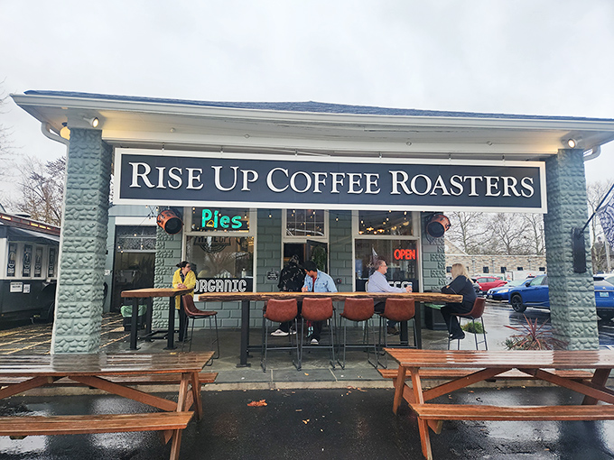 The Eastern Shore's coffee sanctuary beckons with rustic picnic tables and an American flag, promising caffeinated salvation for weary travelers.