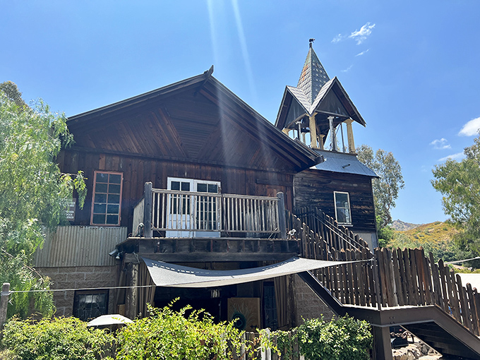 The Old Place looks like it wandered off a Western movie set and decided to serve steaks instead. Motorcycles and weathered wood tell you you're somewhere special.