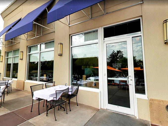 Newport Grill's exterior welcomes you with cheerful blue umbrellas and a sunny patio&mdash;like the Mediterranean coast decided to vacation in Kansas. 