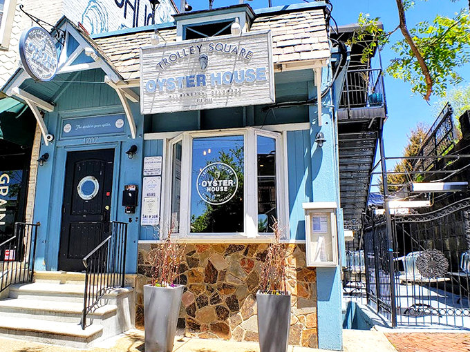 The blue facade of Trolley Square Oyster House beckons like a coastal lighthouse in urban Wilmington. Nautical charm meets historic neighborhood vibes.