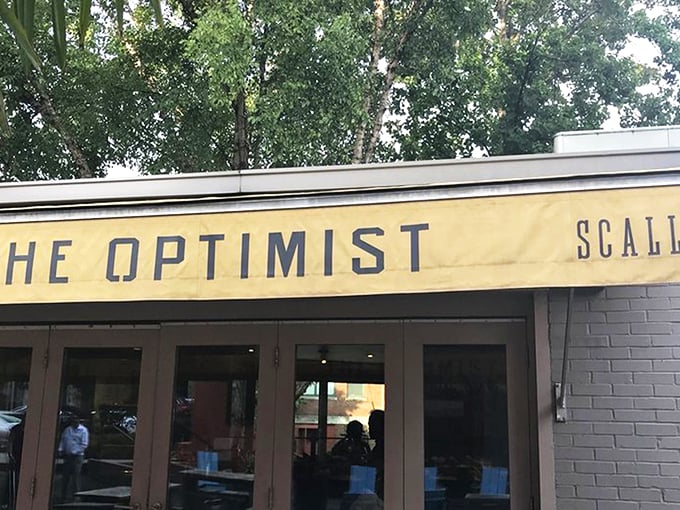 The outdoor oasis at The Optimist proves that sometimes the best appetizer is fresh air and a mini-golf challenge before diving into seafood heaven.