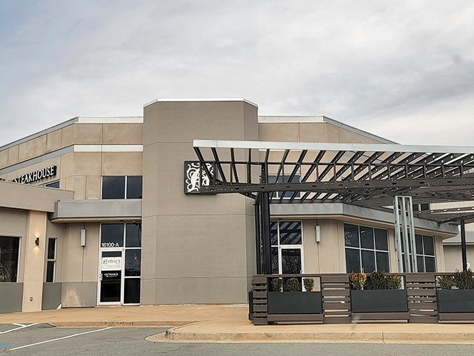 The modern fa&ccedil;ade of Arthur's Prime Steakhouse belies the old-world charm within. String lights create an inviting glow as evening approaches.