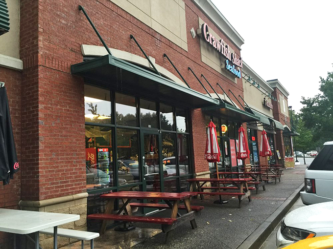 The red neon sign beckons like a lighthouse for seafood lovers. Strip mall location, zero pretension&mdash;just the promise of oceanic treasures within.