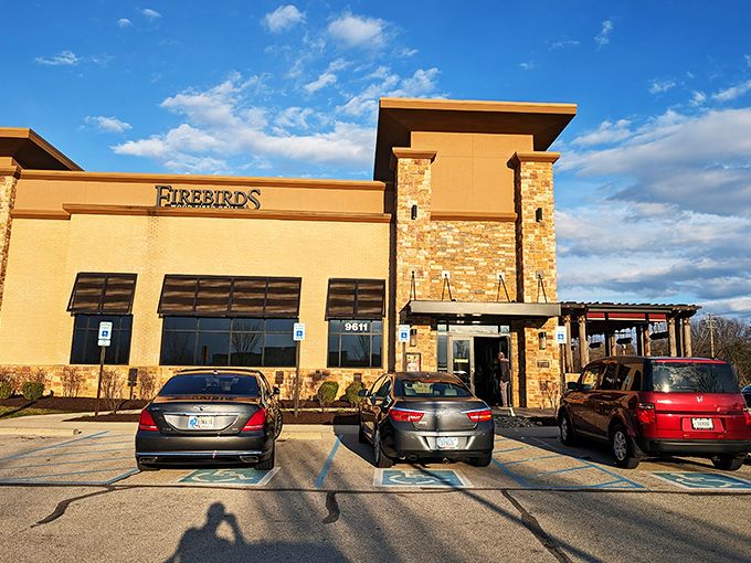 Modern meets rustic at Firebirds' exterior, where stone pillars and contemporary architecture promise a dining experience beyond the ordinary.