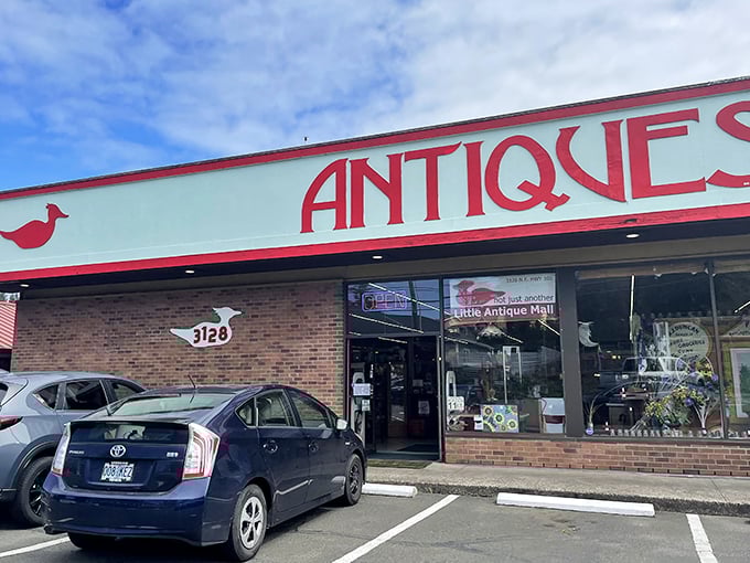 The unassuming exterior of Little Antique Mall belies the wonderland within. That bold red "ANTIQUES" sign is like a beacon to treasure hunters on Highway 101.