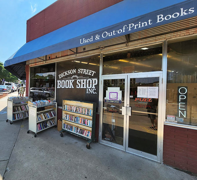 The brick-red exterior with its cheerful blue awning beckons bibliophiles like a literary lighthouse on Fayetteville's Dickson Street. This isn't just a store&mdash;it's a destination.