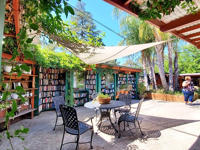 A literary wonderland unfolds beneath corrugated roofing, where signage guides bibliophiles through this open-air maze of knowledge.