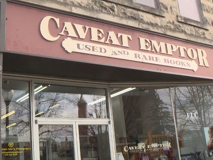 The storefront of Caveat Emptor beckons like a literary siren song. Latin for "buyer beware," but the only danger here is losing track of time.