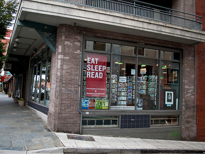The iconic "EAT SLEEP READ" sign beckons bibliophiles like a literary lighthouse on Haywood Street. Downtown Asheville's brick-and-mortar sanctuary for the written word.