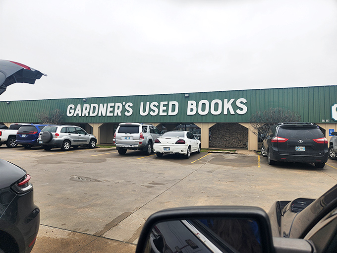 The green-sided literary fortress beckons from the roadside, promising adventures bound between covers rather than pixels.