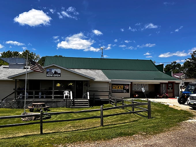 The weathered wooden exterior of Gunder Roadhouse stands as a beacon for burger pilgrims, its simple sign promising legendary satisfaction inside.
