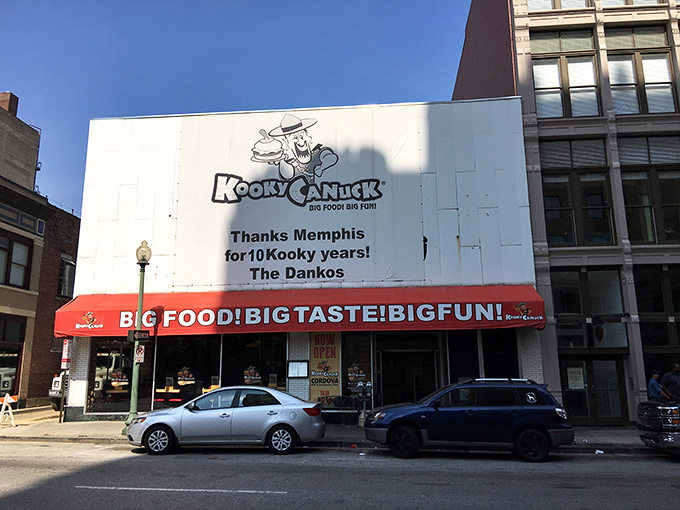 The iconic maple leaf sign beckons hungry adventurers to Kooky Canuck, where Canadian charm meets Memphis hospitality on downtown's bustling streets.