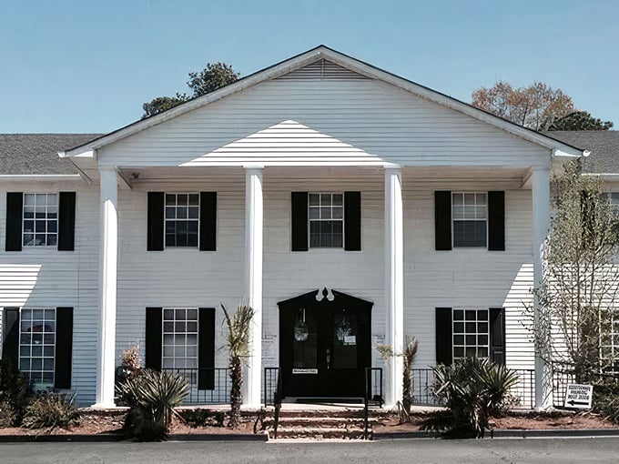 Southern charm meets textile heaven in this stately white mansion. Who knew fabric shopping could come with columns and palm trees?