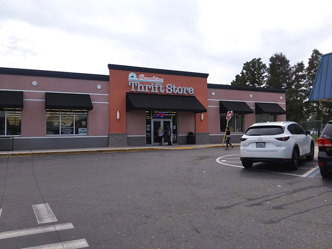 The coral-colored fa&ccedil;ade of Sunshine Thrift Store stands out like a beacon of bargain hope against Florida's perpetually cheerful sky.