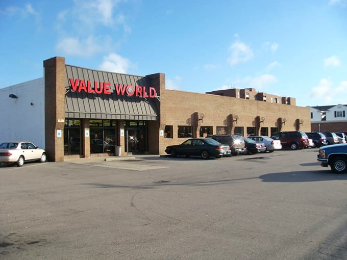 The brick facade of Value World stands proudly against a blue Michigan sky, like a fortress guarding treasures waiting to be discovered.
