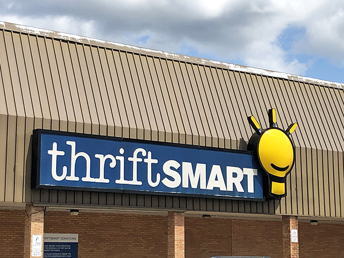 The familiar blue and yellow sign beckons like a lighthouse for bargain hunters, promising treasures within those unassuming brick walls.