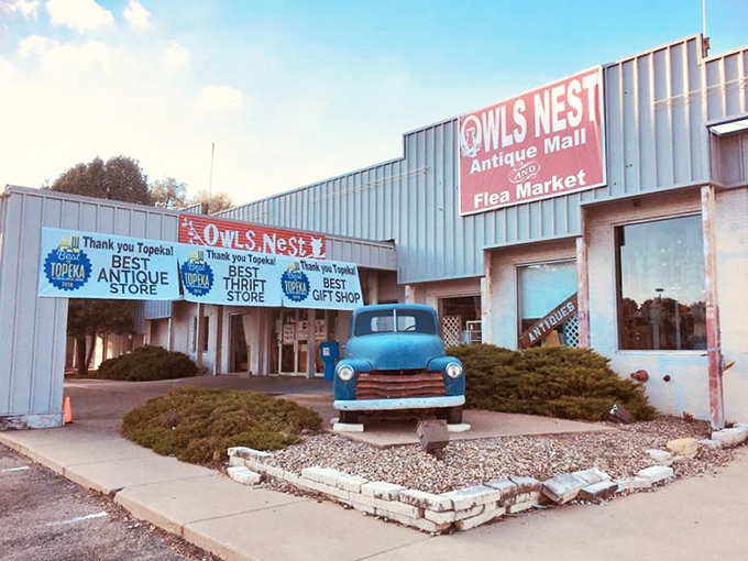The unassuming exterior of Owls Nest hides a universe of treasures within, like finding a portal to the past behind that classic blue pickup truck.